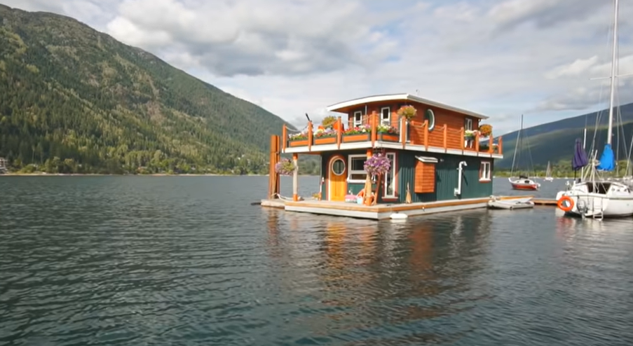 Man builds impressive 2-story tiny home that floats, has a wraparound ...