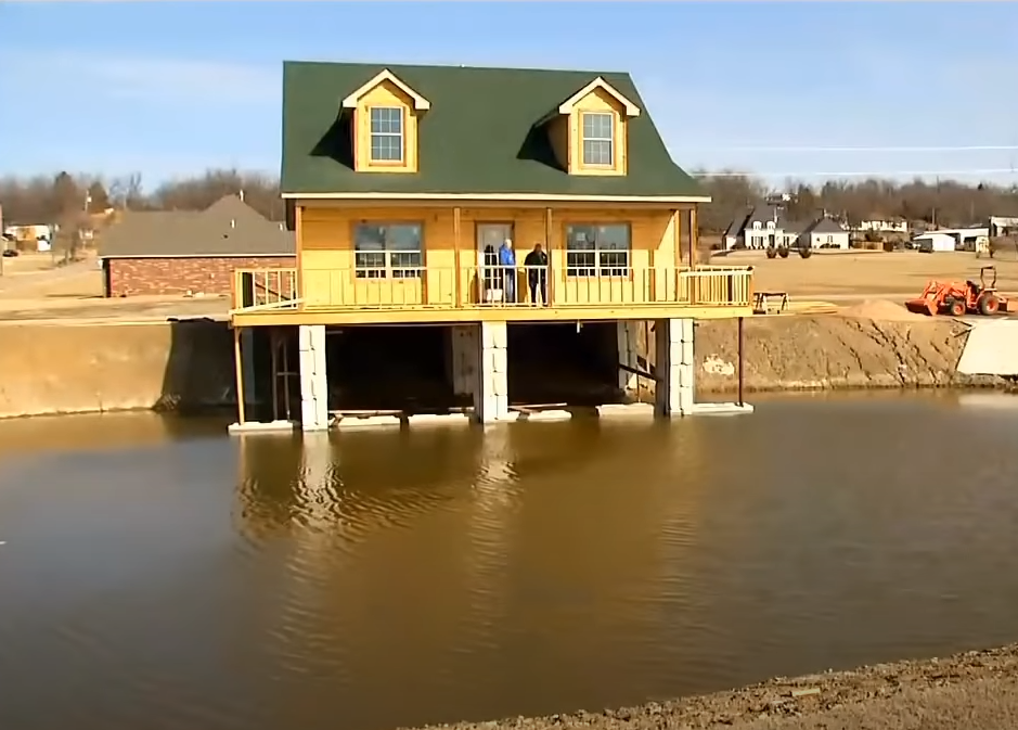 Man builds house on top of pond and fishes from living room floor