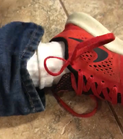 Young Boy Demonstrates Shoe Tying Trick