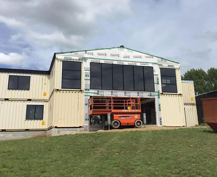 Guy buys 12 plain shipping containers & turns them into one massive ...