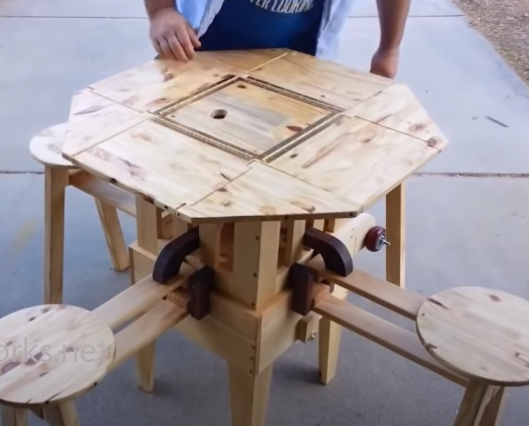 Man’s Design Turns Small Box Into Table That Seats Four Men