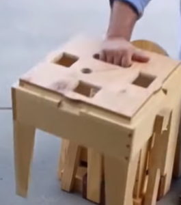 Man’s Design Turns Small Box Into Table That Seats Four Men