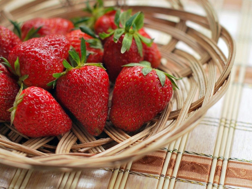 Grow strawberries at home using a laundry basket from the dollar store