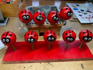 Upcycle old golf balls into adorable ladybugs for your garden