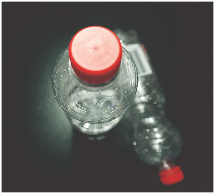 Cut tops off empty bottles and tape them together to make beautiful ...