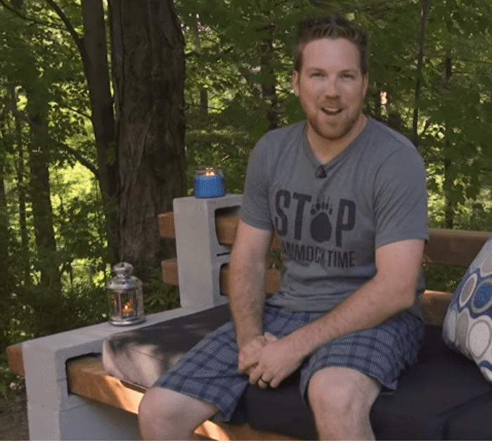 Man stacks cinder blocks then adds one more item to make modern bench ...
