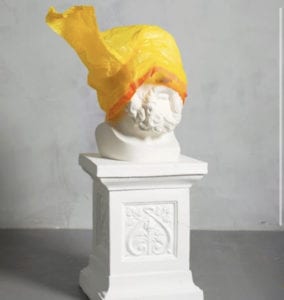 Man wraps plastic wrap around a tree for a mind-bending art illusion