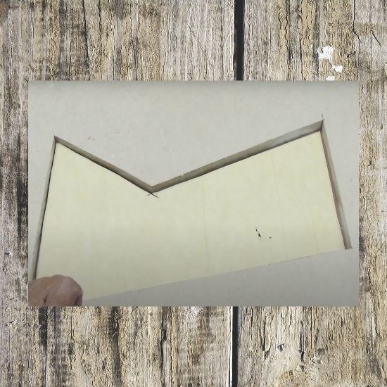 Woman uses tick stick to demostrate old carpentry hack for copying patterns