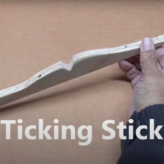 Woman uses tick stick to demostrate old carpentry hack for copying patterns