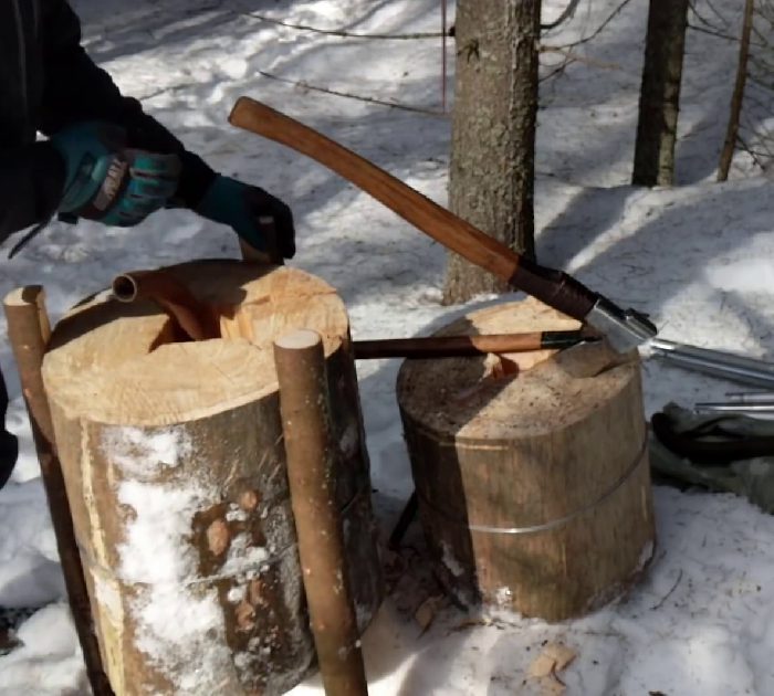 Outdoorsman shows how to heat a camping tent using a pipe and Swedish ...