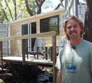 Man builds genius home out of shipping container that sits over a stream