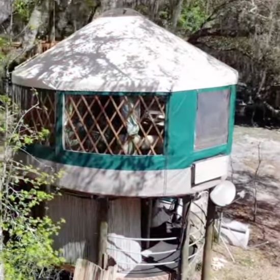 Fun-loving senior builds yurt treehouse to adorn his “mini-town”
