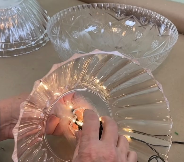 Lady strings lights through Dollar Tree bowls for beautiful Christmas ...