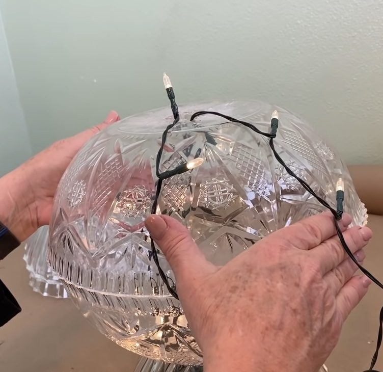 Lady strings lights through Dollar Tree bowls for beautiful Christmas ...