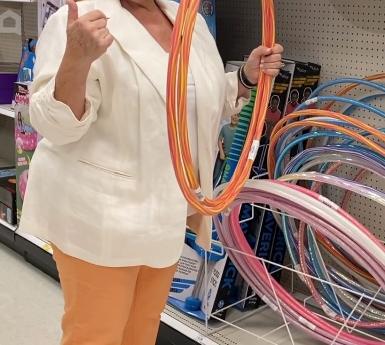 Woman covers 3 hula hoops in gold paint for fairytale garden idea