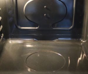 Woman shows how quickly an oven cleans with a dishwasher tablet