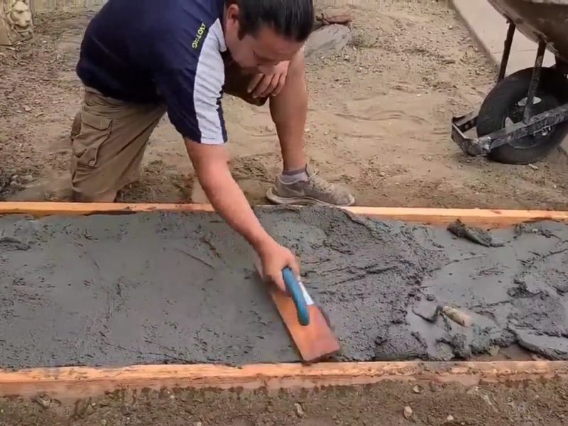 Make beautiful garden paths with cement and “stone stamps”