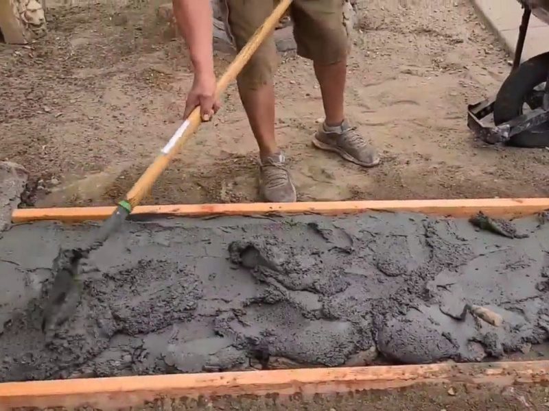 Make beautiful garden paths with cement and “stone stamps”