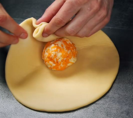 Fold a ball of cheese into dough with spices for the tastiest decadent ...