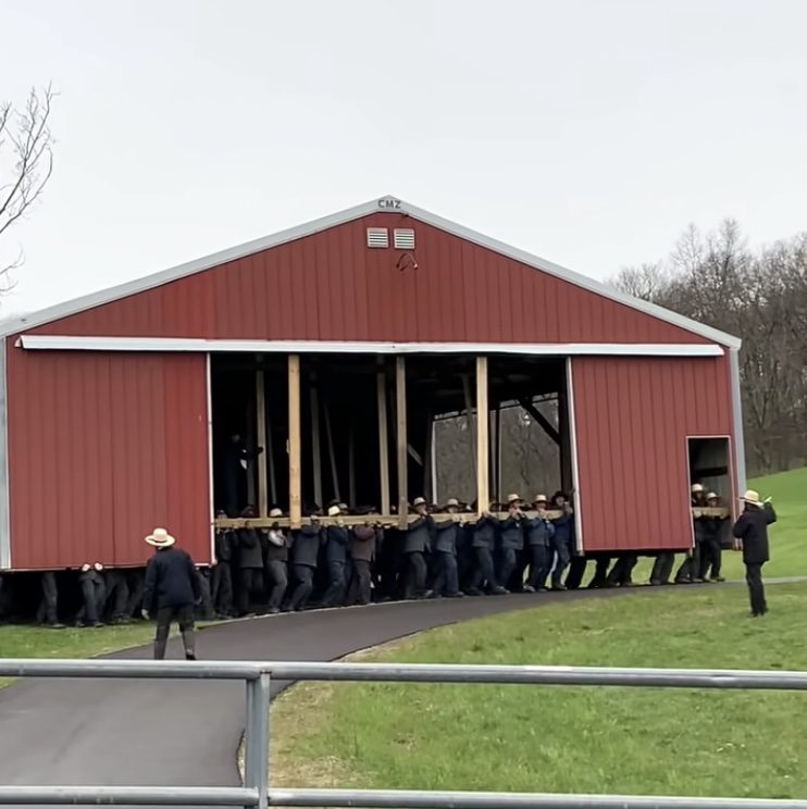 Hundreds of Amish men use their bare hands to lift barn and bring it to ...