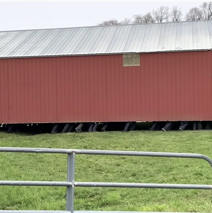 Hundreds of Amish men use their bare hands to lift barn and bring it to ...