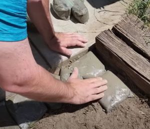 Guy lays baggies of concrete in his yard for gorgeous DIY garden feature