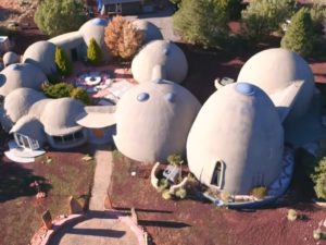 Man inflates huge balloons and sprays them with foam to create ...