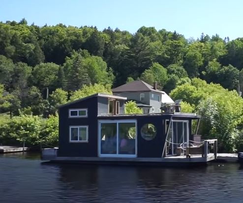 Woman builds a gorgeous floating tiny home and gives a tour of the inside
