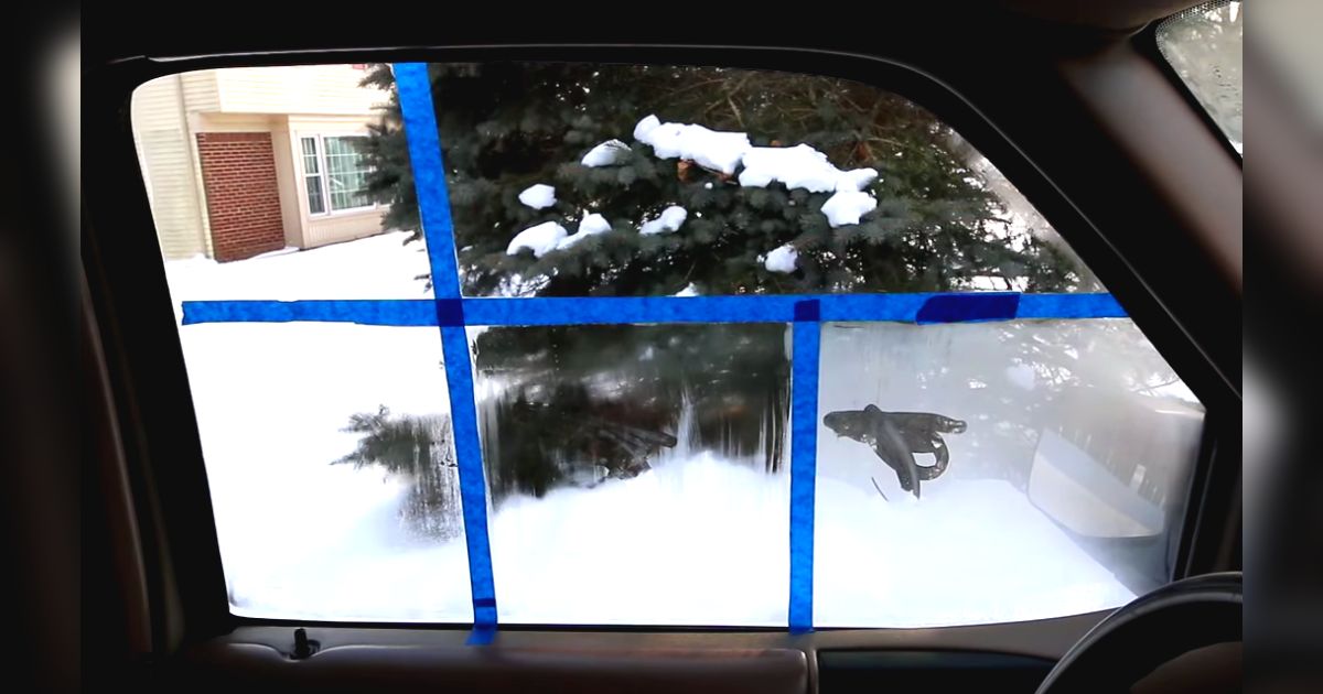 Man uses strips of painter’s tape to show how to easily defog car windows