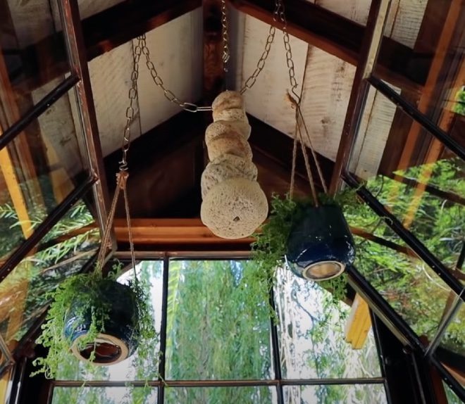 Couple turns WW2 traincar into a magical tiny home from another time