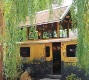 Couple turns WW2 traincar into a magical tiny home from another time