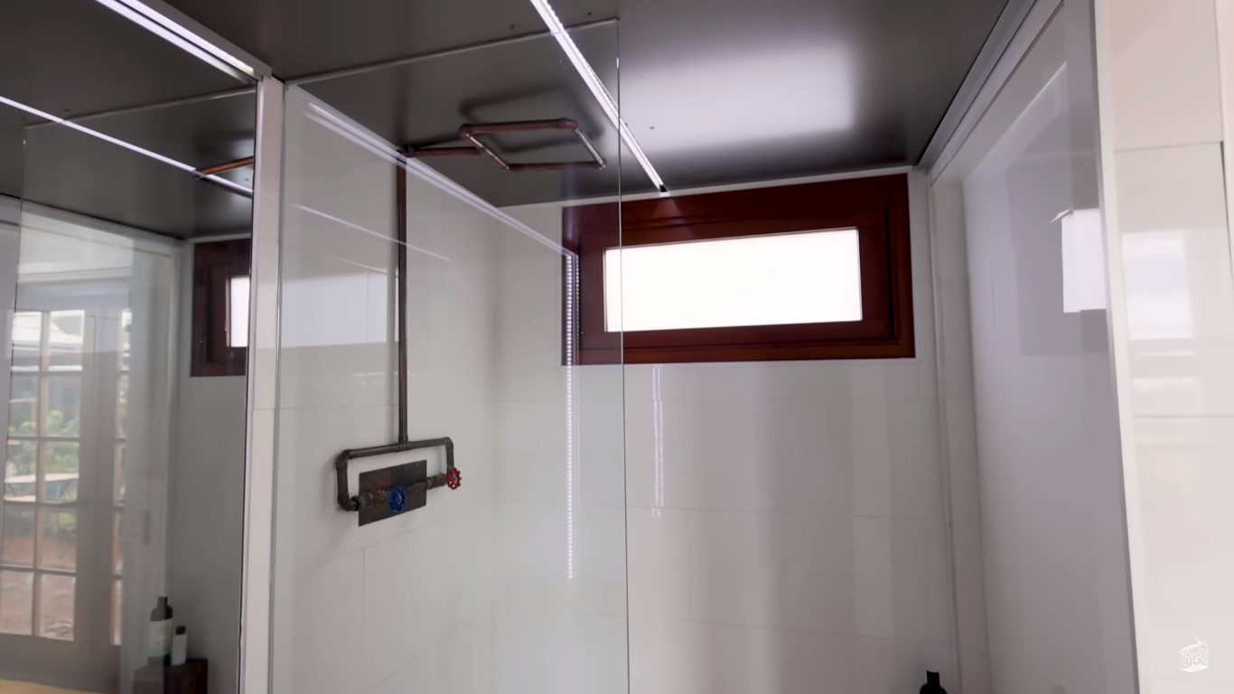 Couple take a low cost shipping container & modernize it with a raised ...