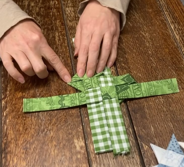 Use 4 strips of fabric to make adorable “no-sew” folded star ornaments
