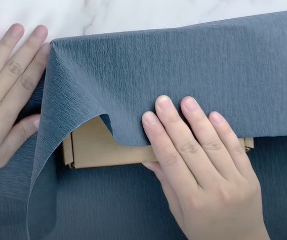 Keep gift-wrapping elegant and simple with a few folds of paper