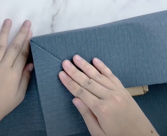 Keep gift-wrapping elegant and simple with a few folds of paper