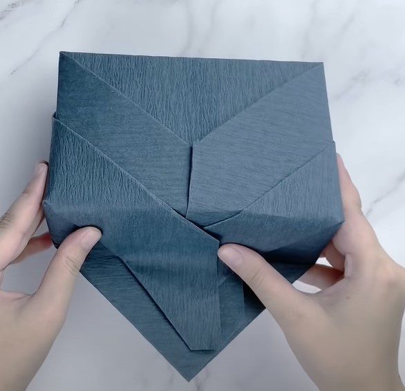 Keep gift-wrapping elegant and simple with a few folds of paper