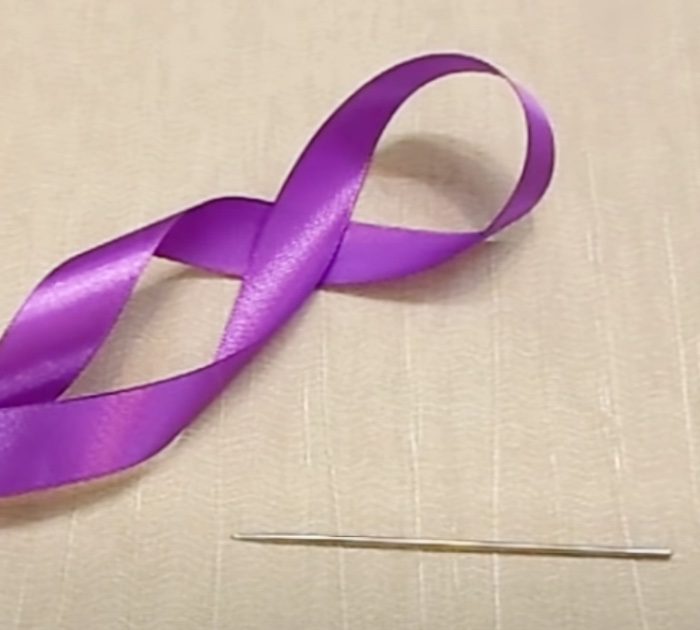 Fold layers of ribbon over needle to make adorable ribbon roses