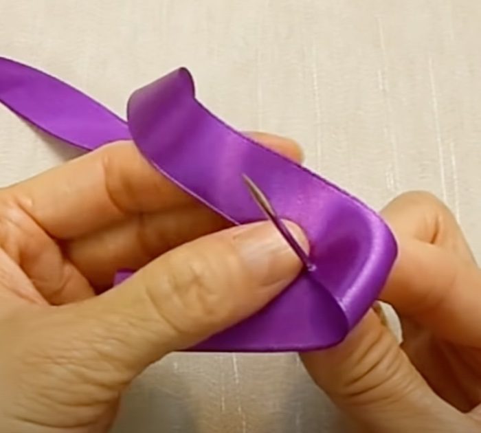 Fold layers of ribbon over needle to make adorable ribbon roses