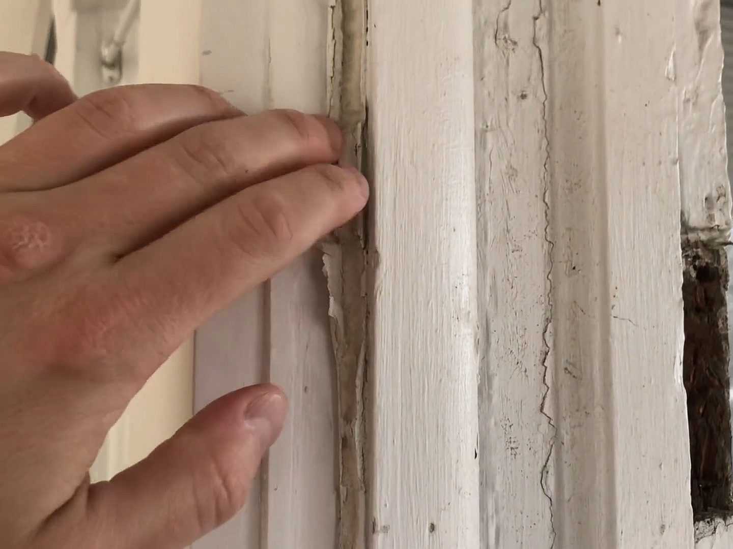 Man shows how to add weather stripping to old doors to keep heat in and ...