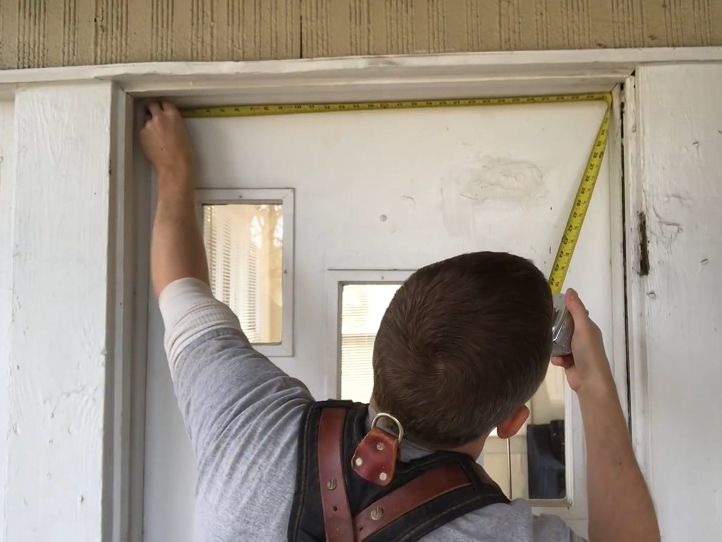 Man shows how to add weather stripping to old doors to keep heat in and ...