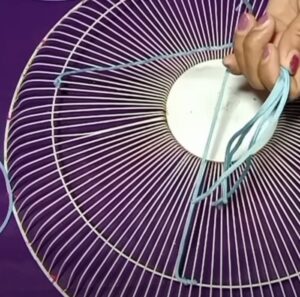 Turn old fan covers into beautiful spiral hanging plant displays with ...