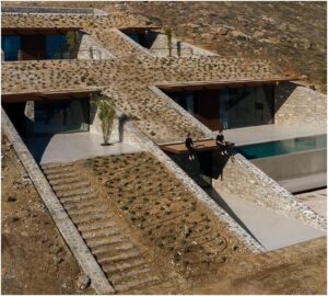 Underground house built into hillside has interior straight out of magazine