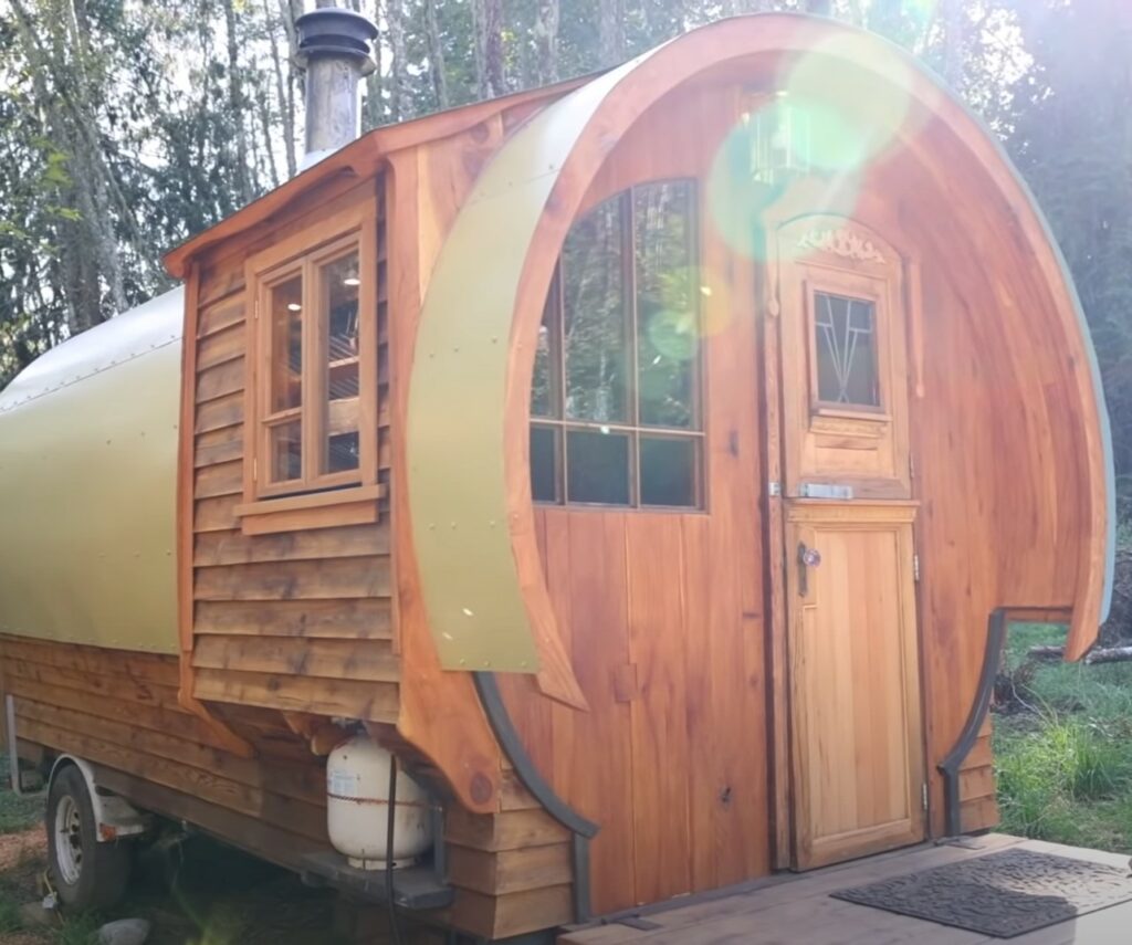 Carpenter builds 17-foot boat trailer into beautiful bow-top wagon home