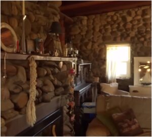 Woman builds her own durable rock house using free materials